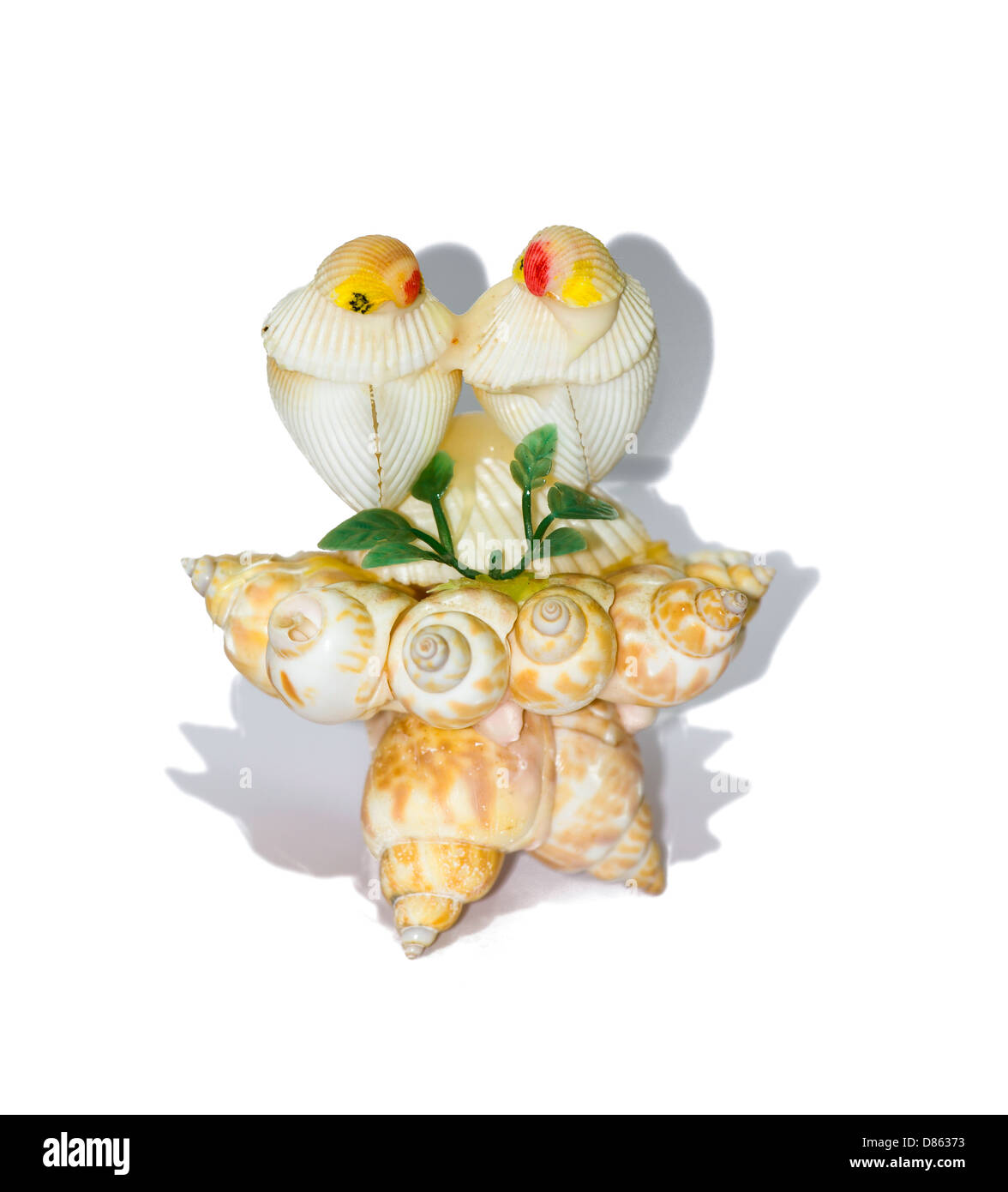 Parrots of seashells on a stand Stock Photo - Alamy