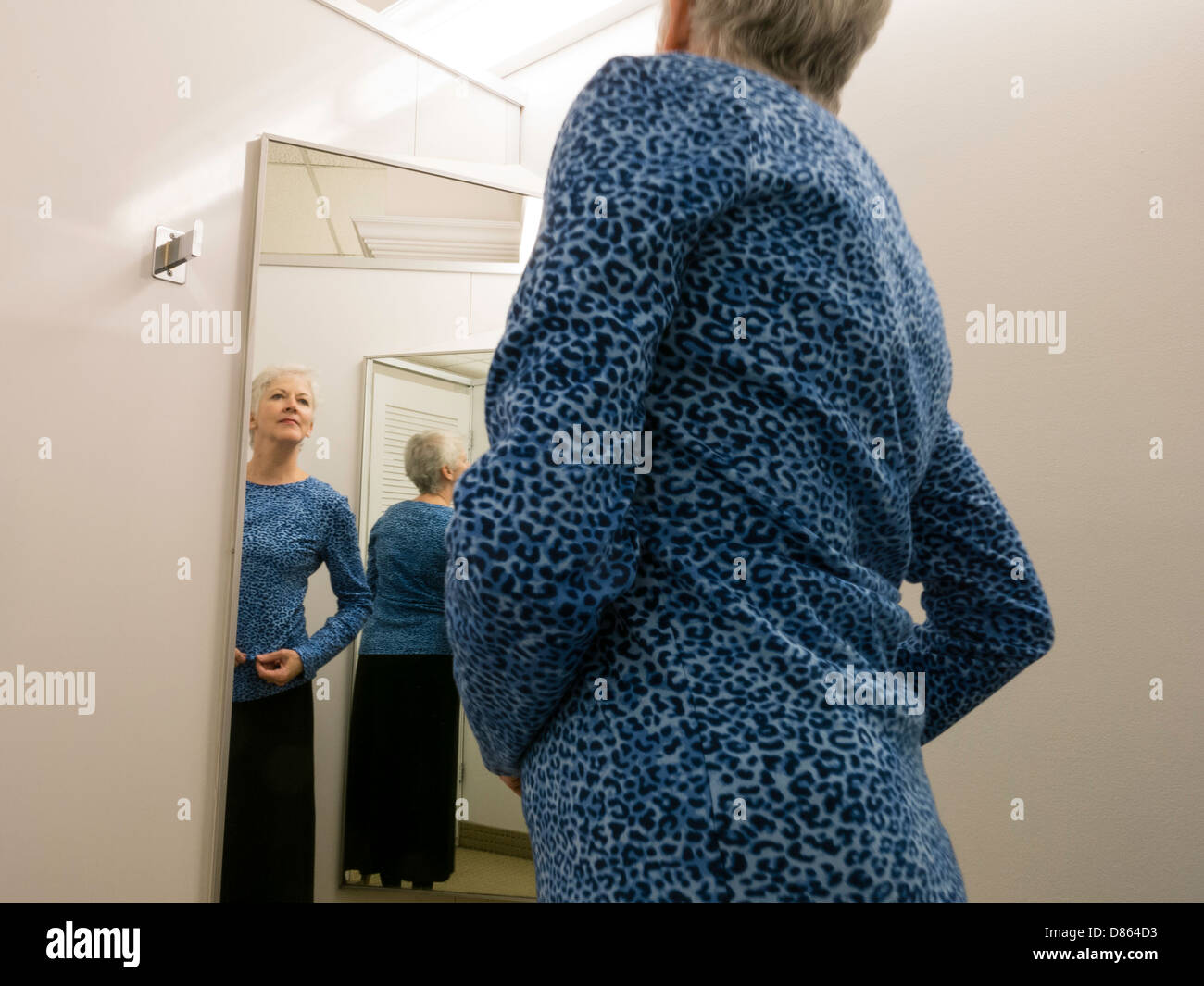 Senior Woman in Store Fitting Room, USA Stock Photo - Alamy