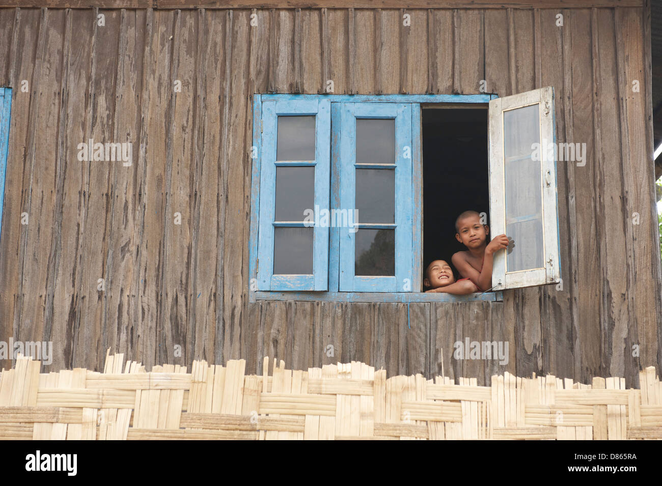 kids playing in the window Stock Photo - Alamy