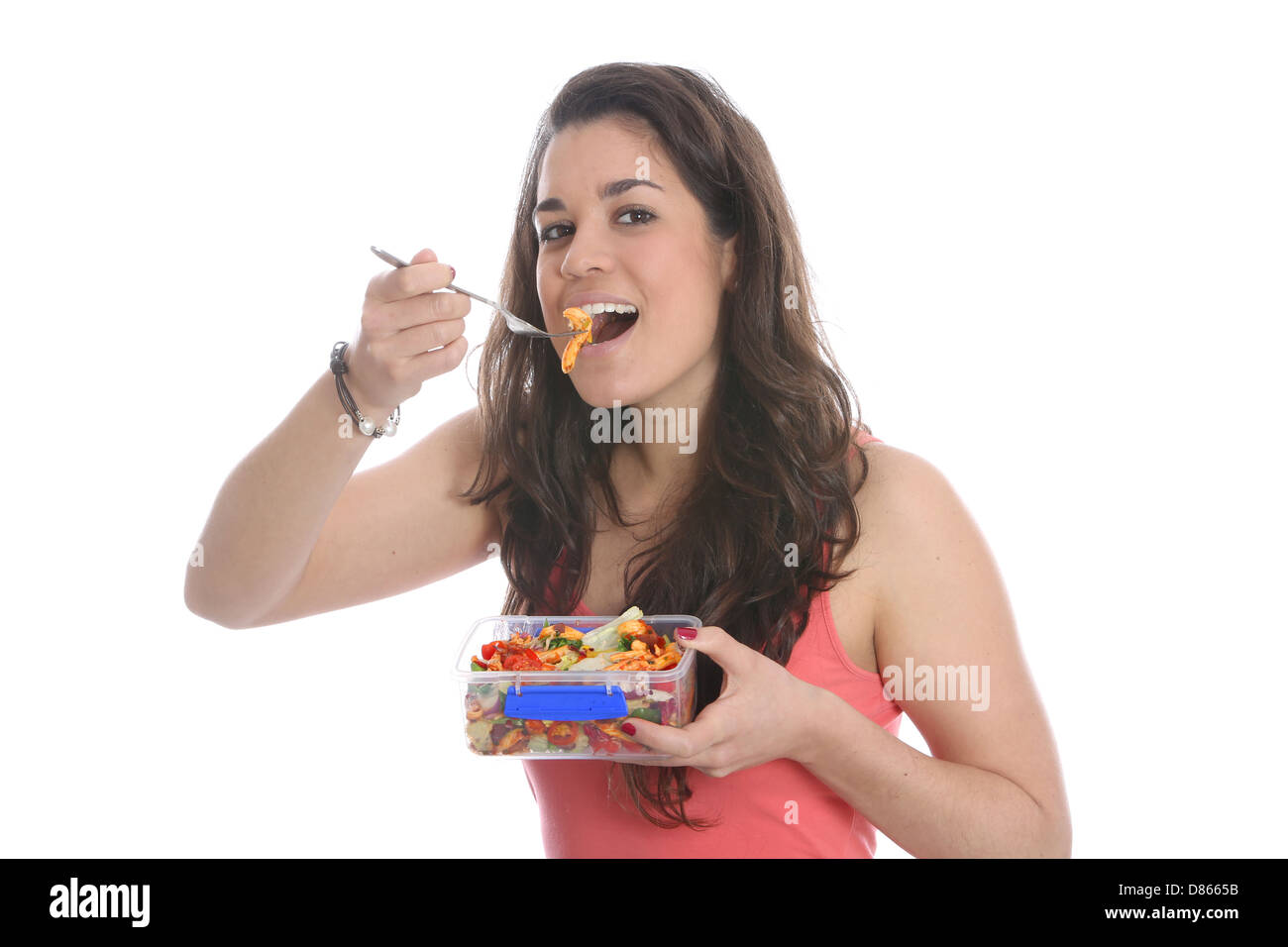 Model Released. Young Woman Eating Pasta Salad Stock Photo - Alamy