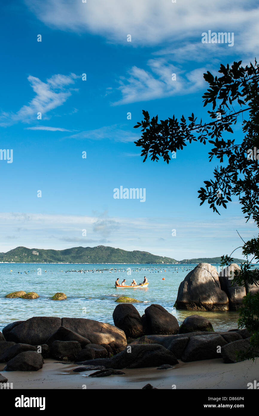 Rowing boat viewed from a distance at Zimbros Beach Stock Photo - Alamy