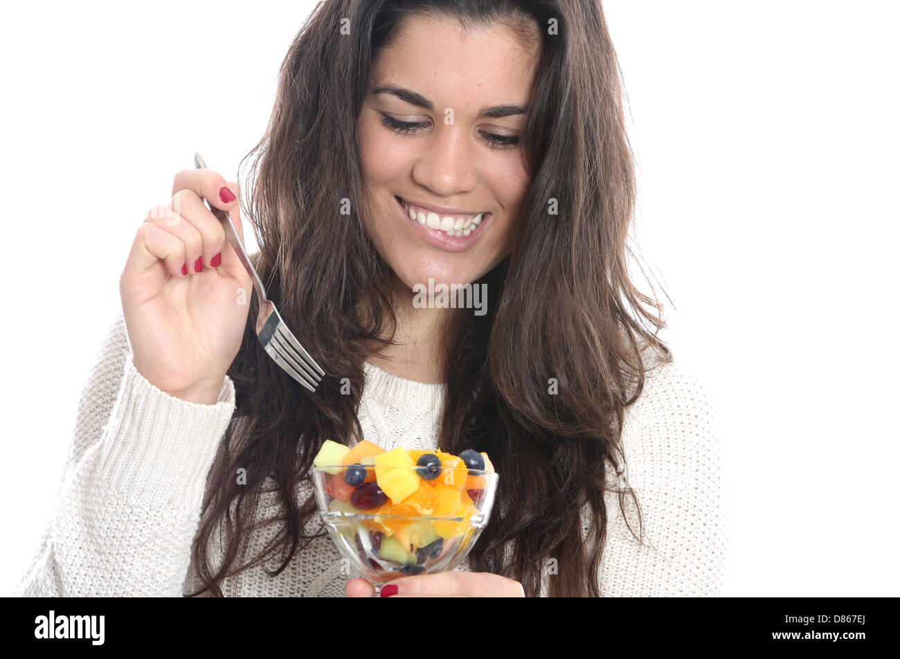 Model Released. Young Woman Eating Fresh Fruit Salad Stock Photo - Alamy