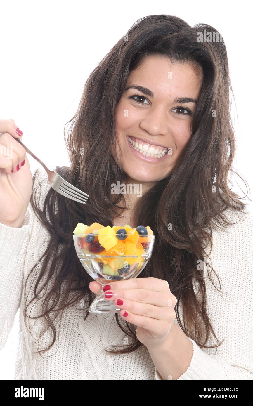 Model Released. Young Woman Eating Fresh Fruit Salad Stock Photo - Alamy