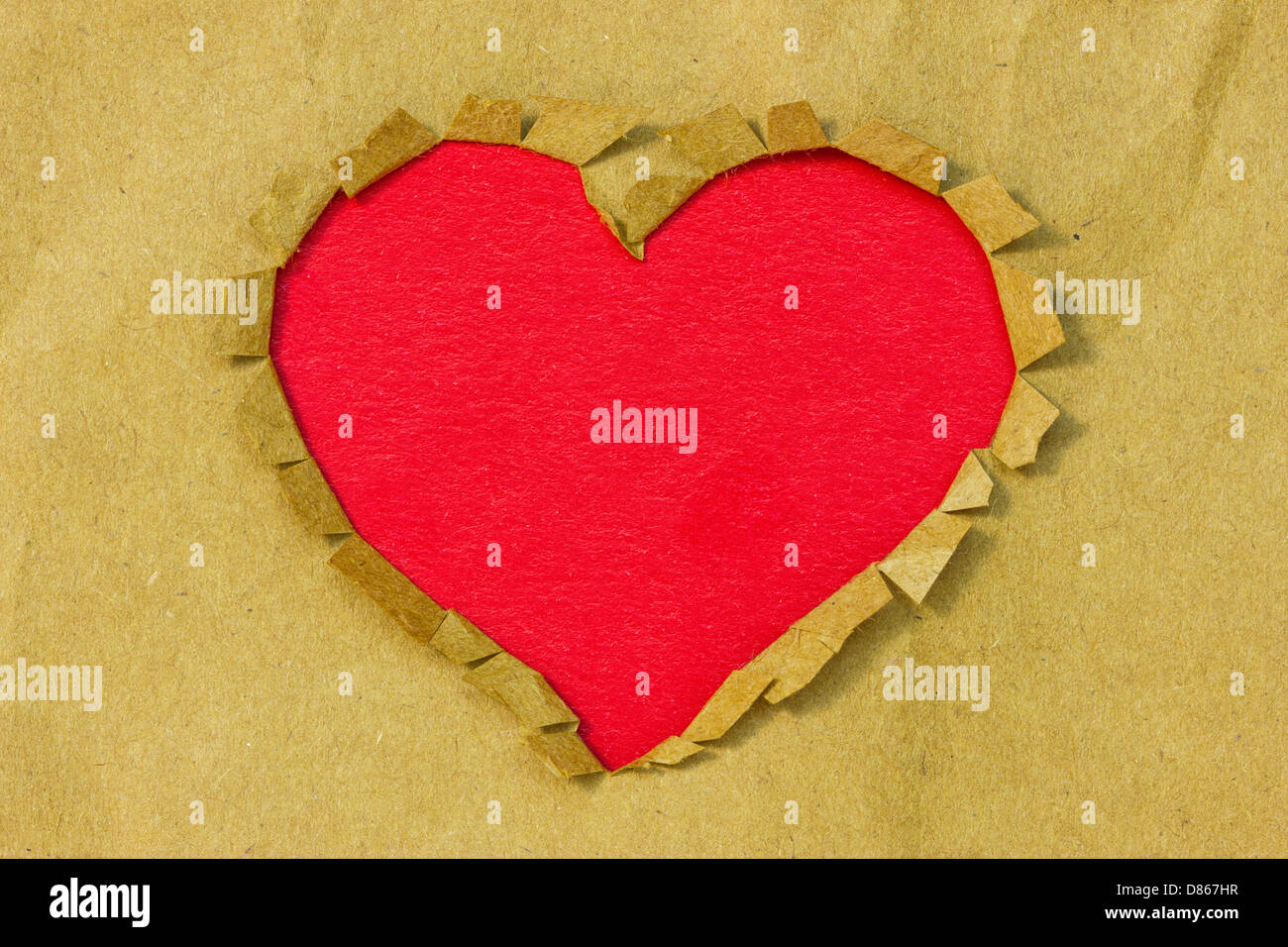 Close-up of a ripped paper hole in a heart shape Stock Photo - Alamy