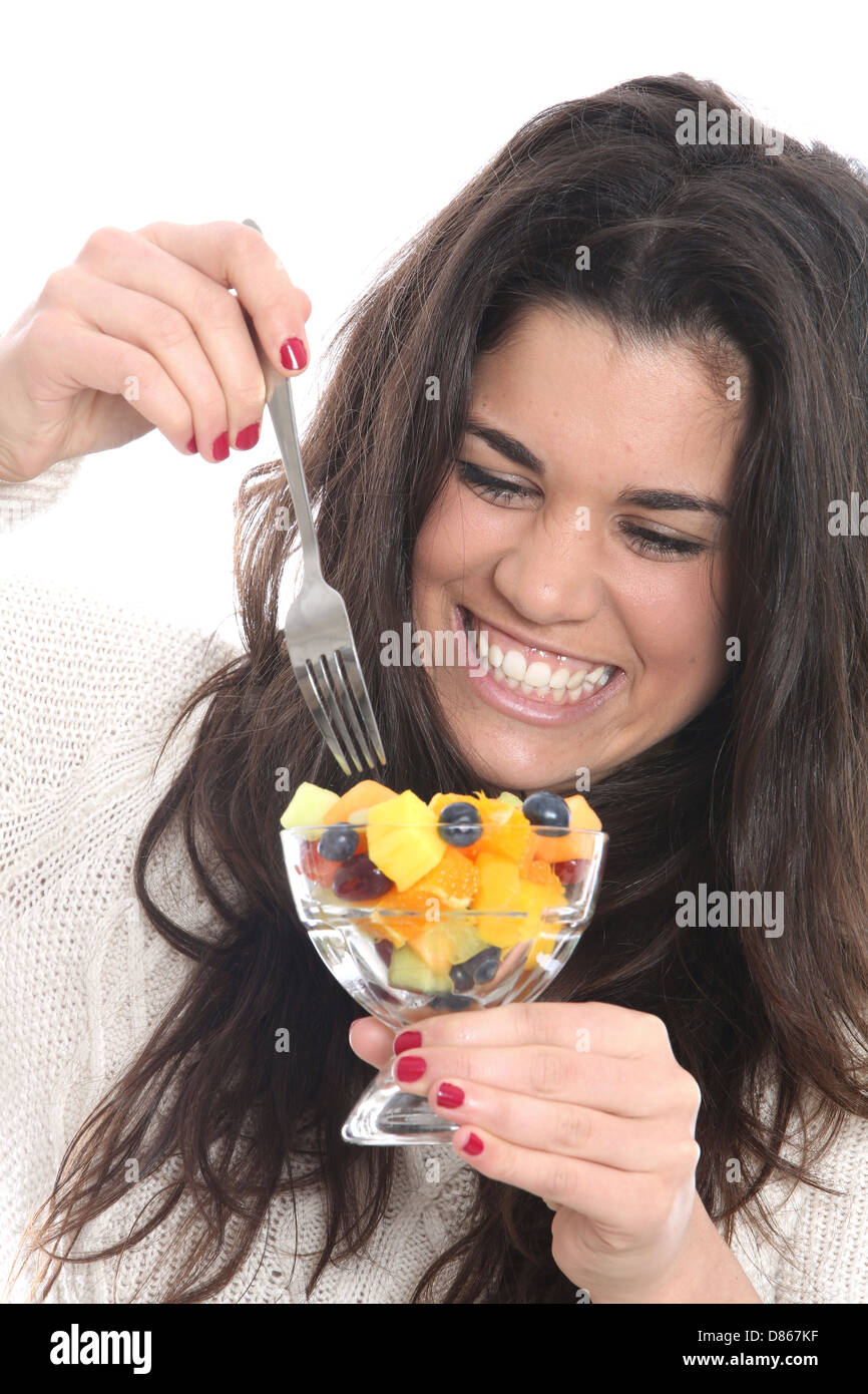 Model Released. Young Woman Eating Fresh Fruit Salad Stock Photo - Alamy
