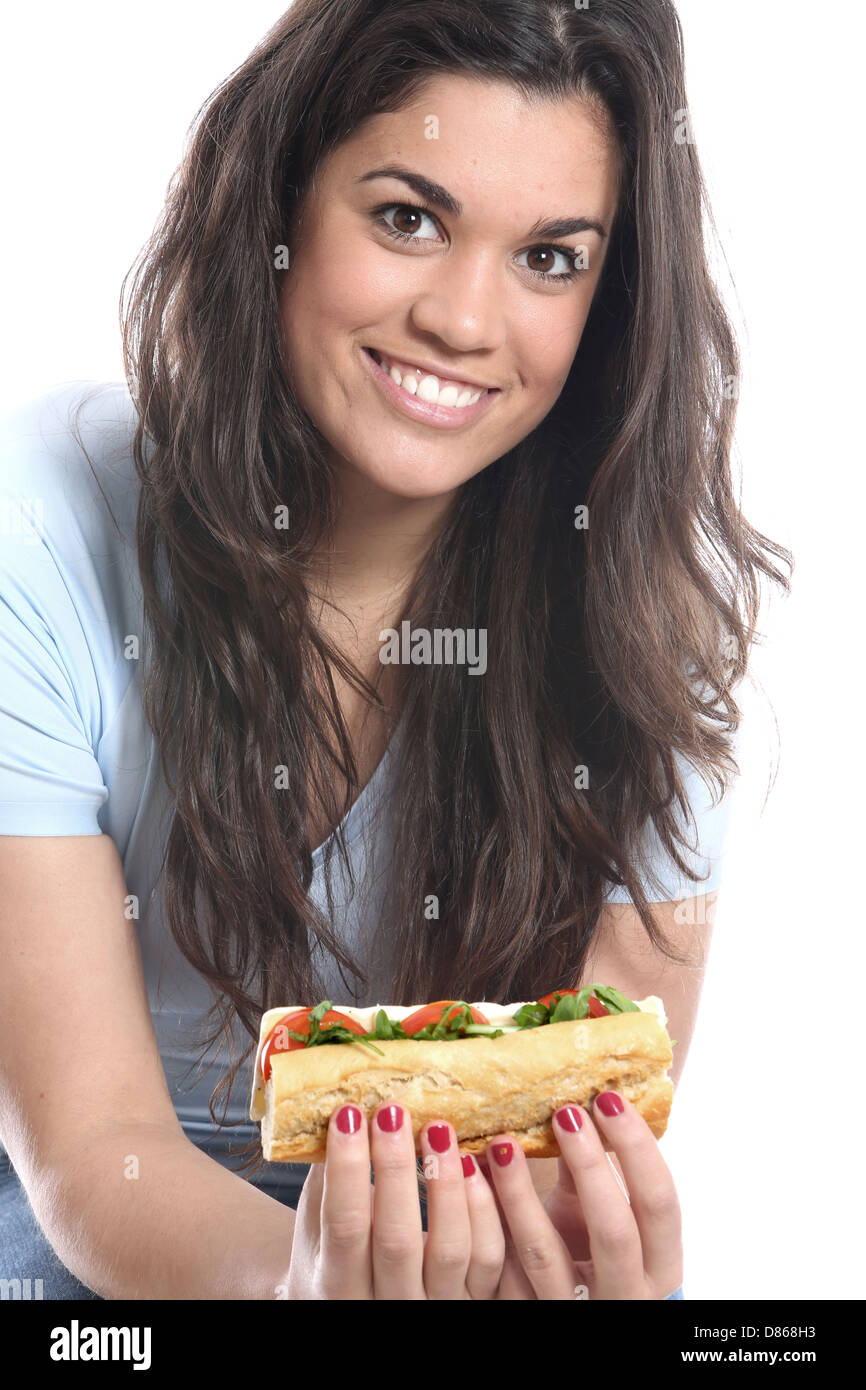 Model Released. Young Woman Eating Cheese and Tomato Roll Stock Photo ...