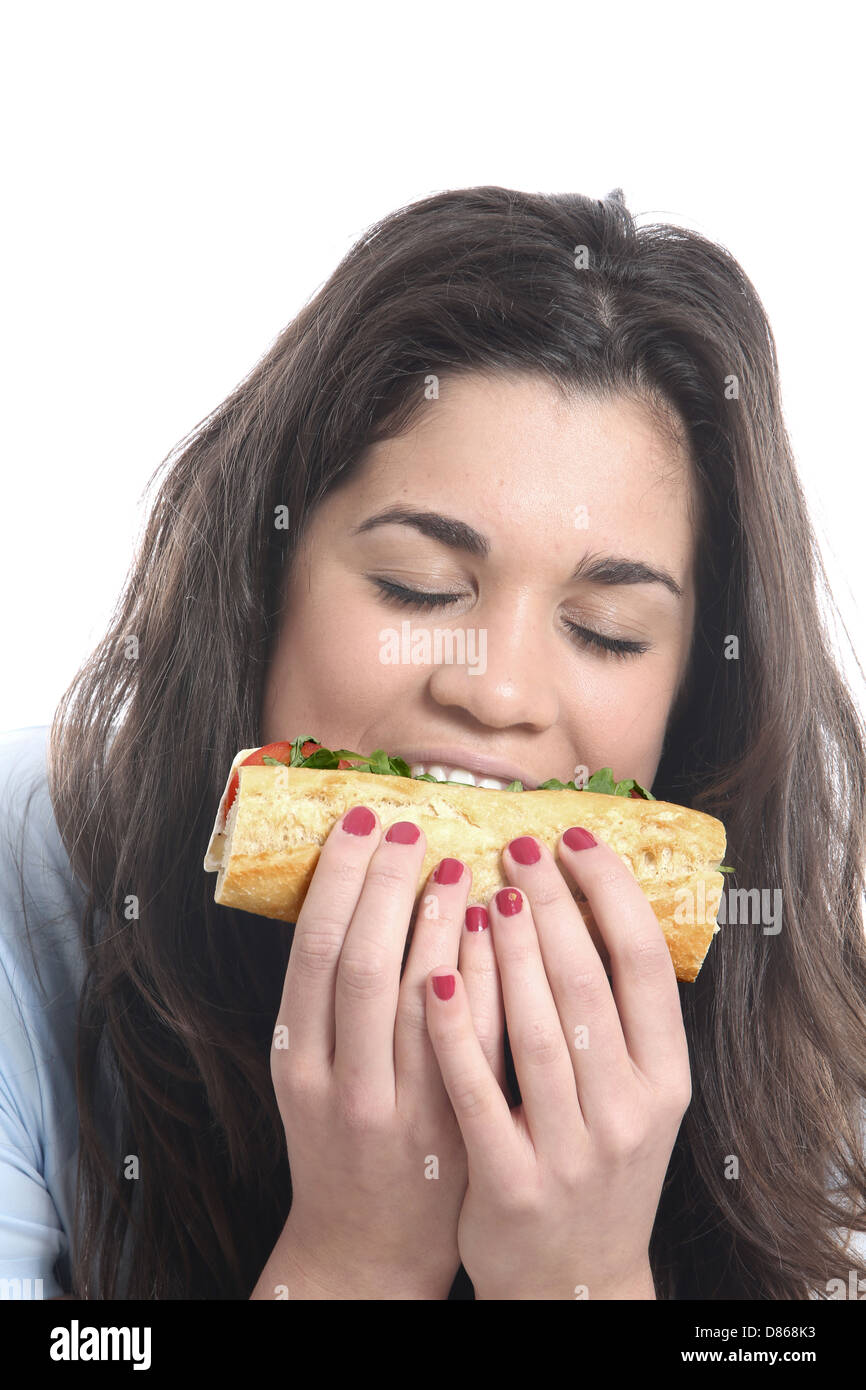 Model Released. Young Woman Eating Cheese and Tomato Roll Stock Photo ...