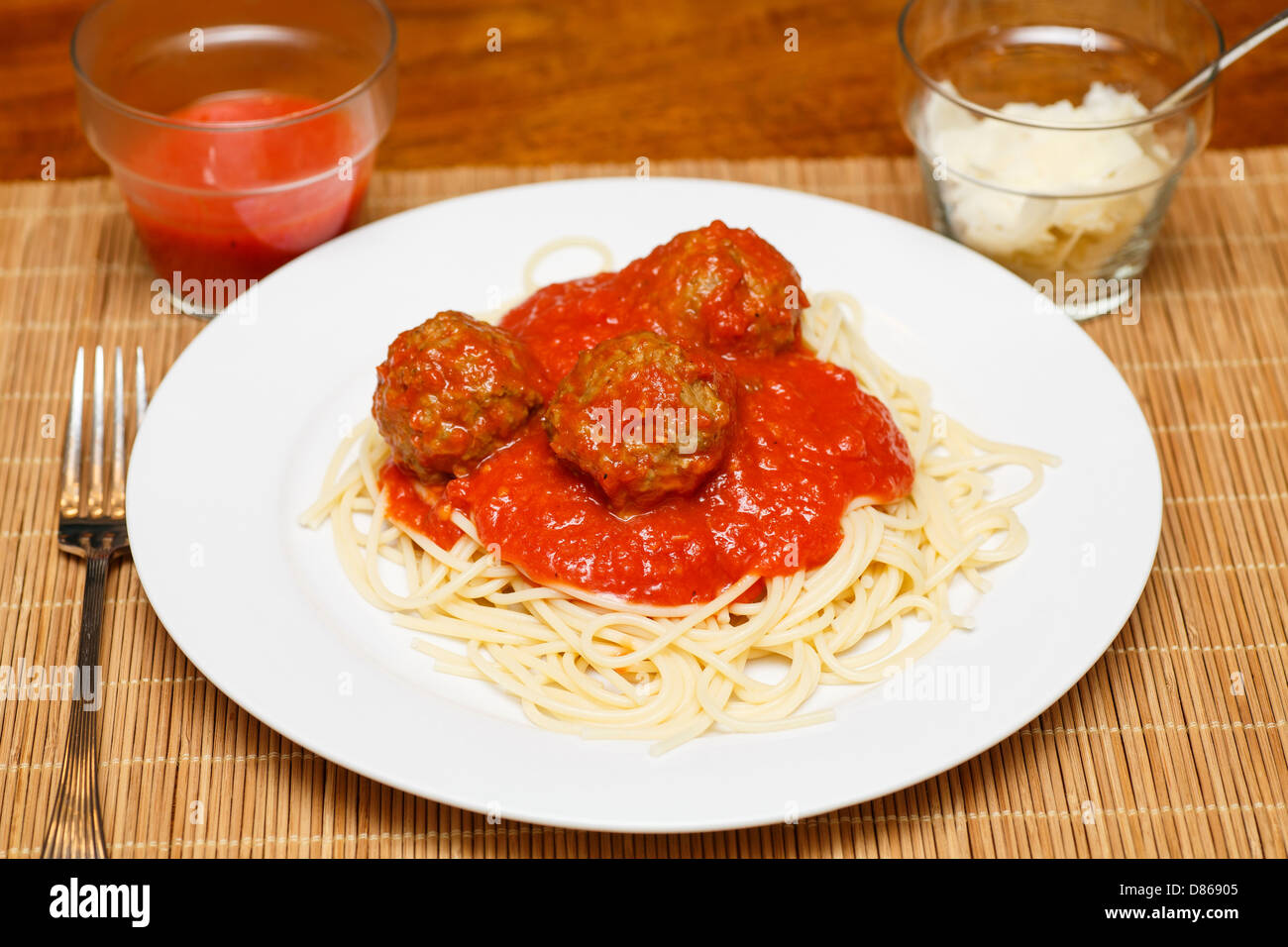 A dinner of spaghetti and meatballs on a white plate Stock Photo - Alamy