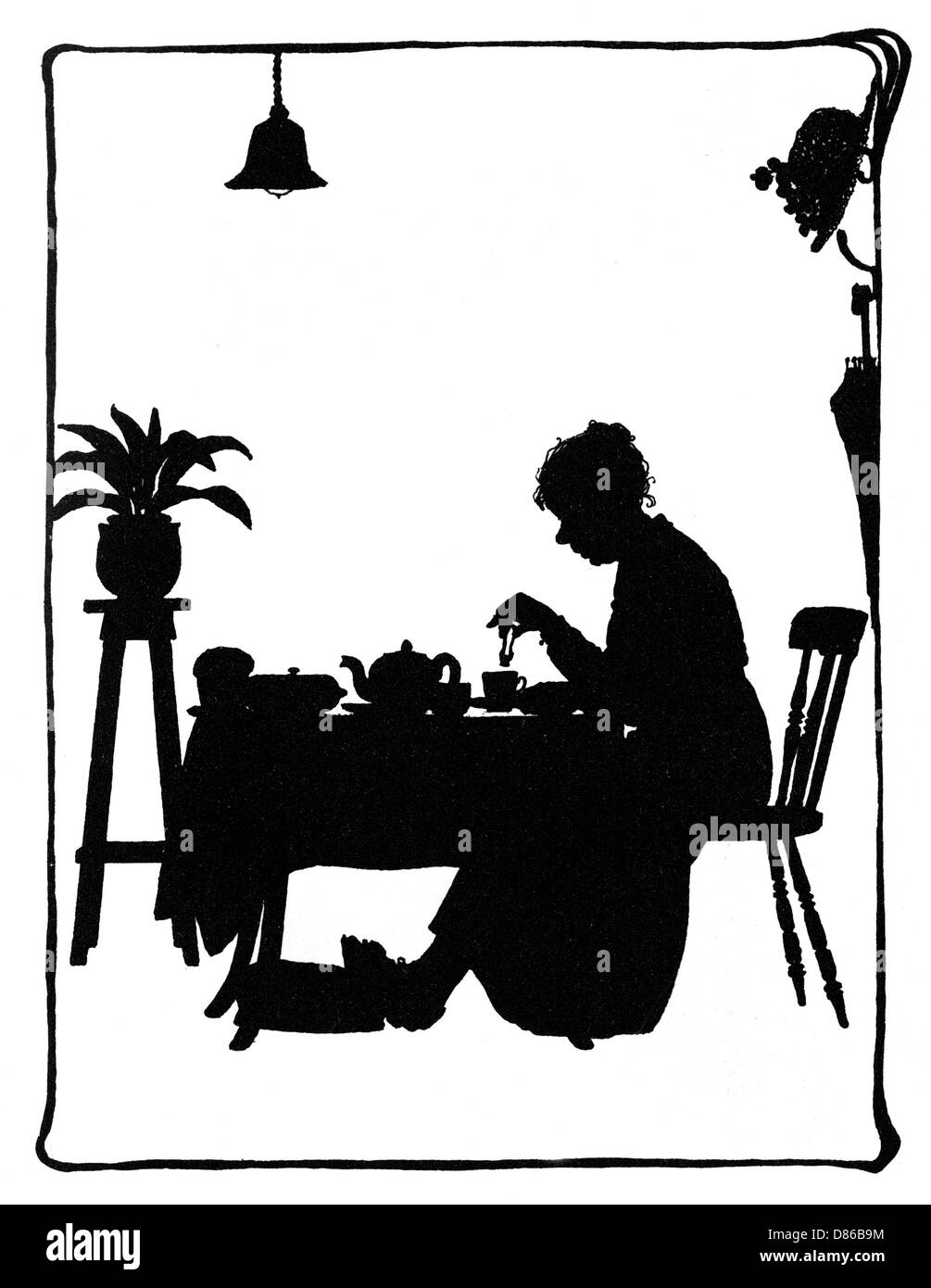 Children sitting table in Black and White Stock Photos & Images - Alamy