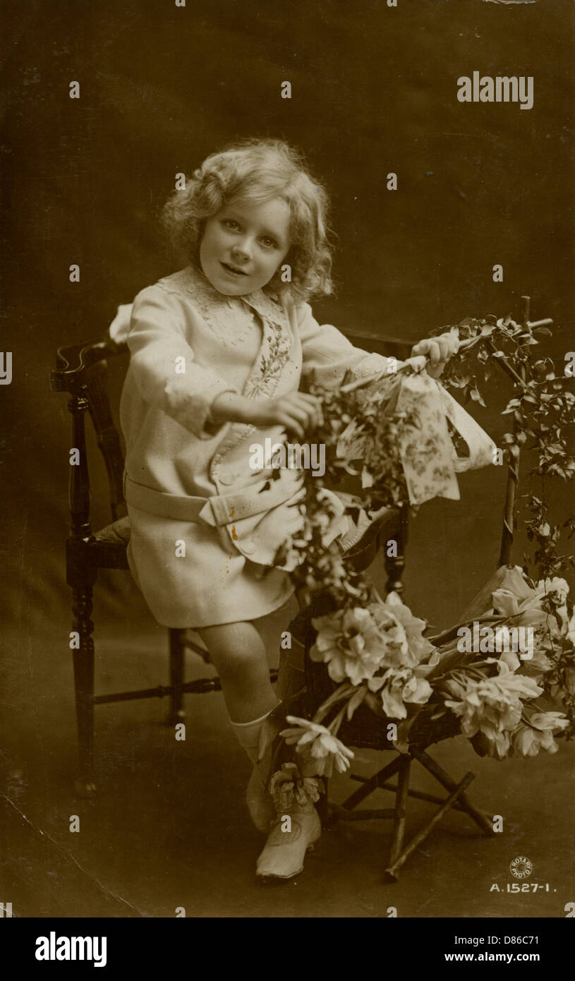 Little girl with garland of flowers Stock Photo - Alamy