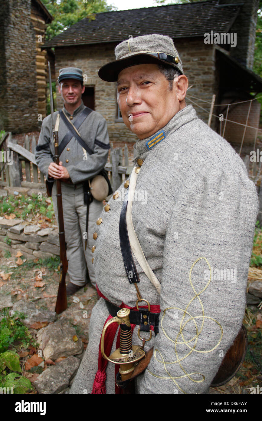 American civil war reenactor in uniform costume near old period ...