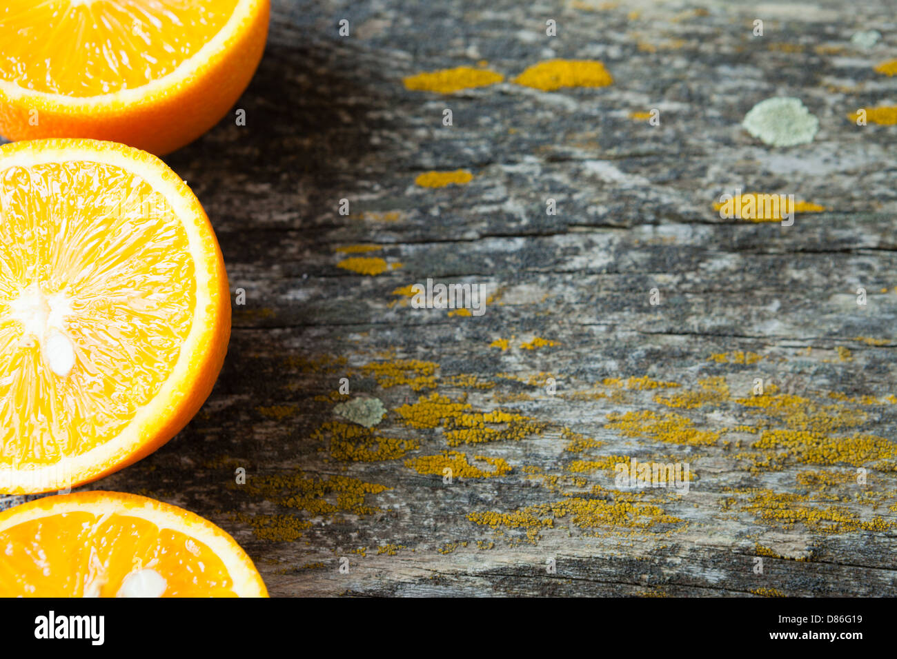 halves of an orange on the boards, horizontal Stock Photo - Alamy