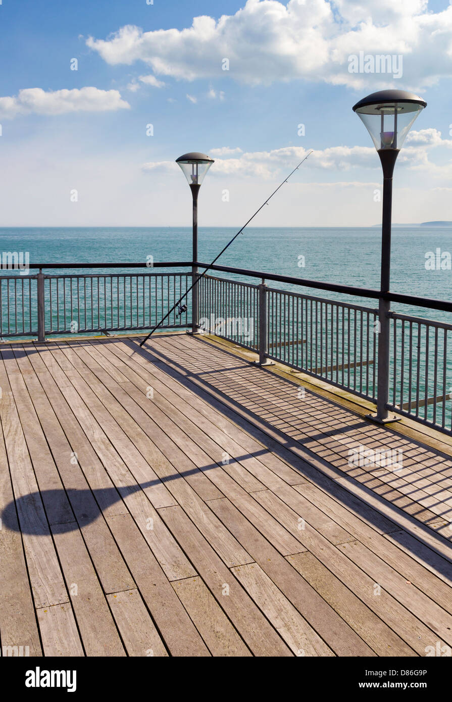Boscombe end of pier unattended fishing rod with Poole Bay visible ...