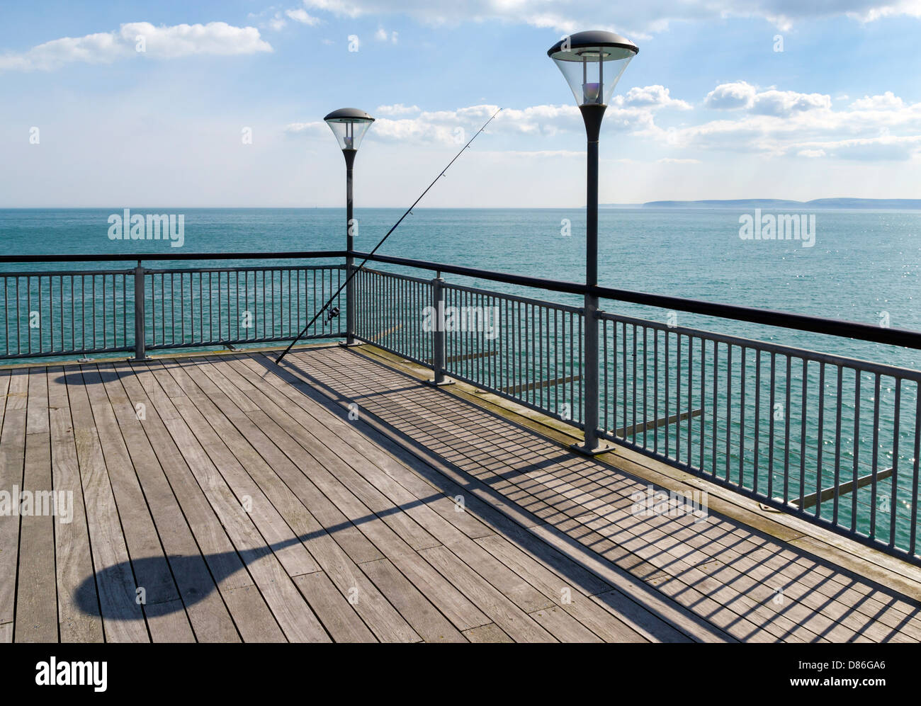 Boscombe end of pier unattended fishing rod with Poole Bay visible ...