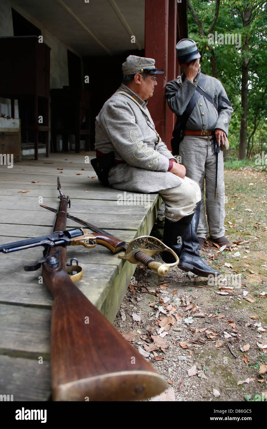 American civil war reenactor in uniform costume near old period ...