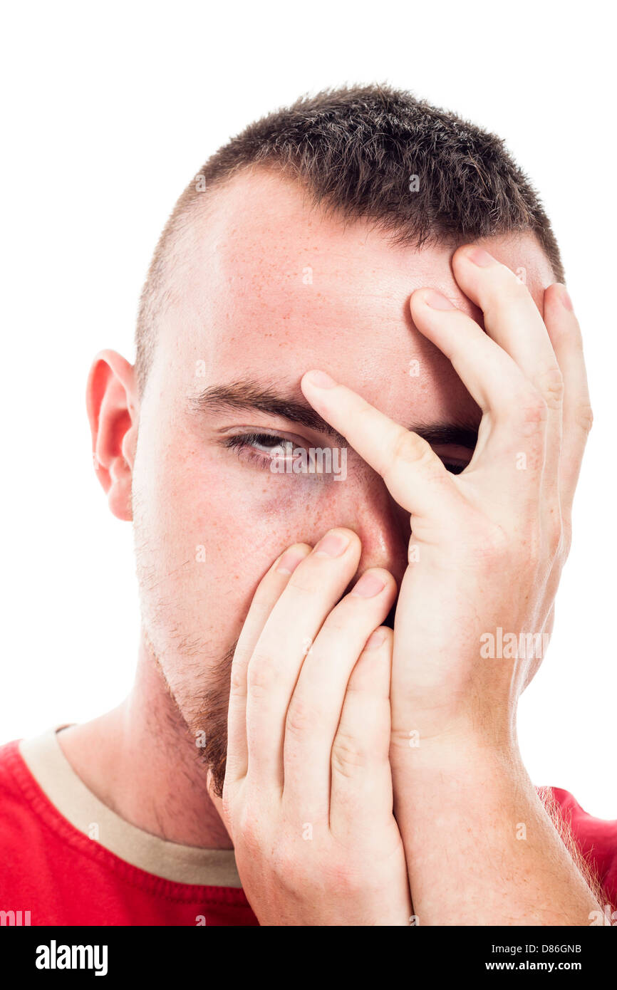 Closeup of depressed man holding his face, isolated on white background ...
