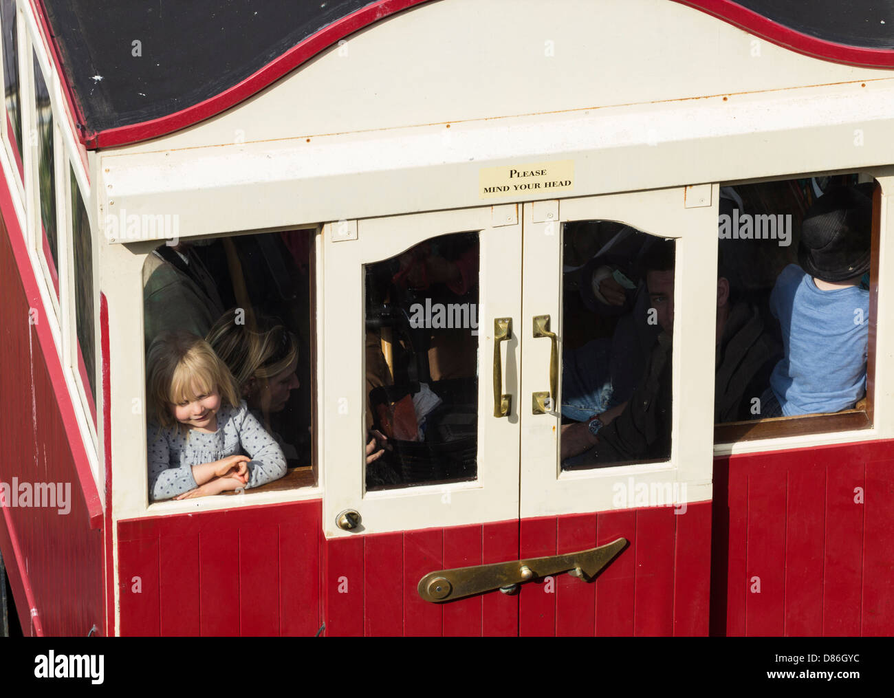 Young girl looking out of window on cliff lift. Saltburn by the sea ...