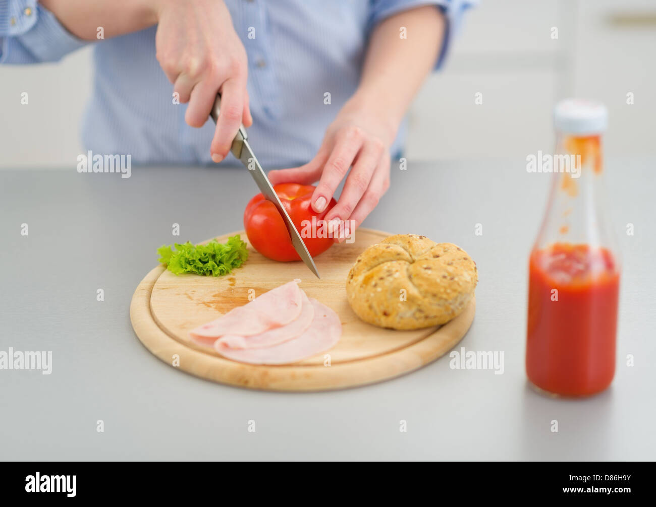 Closeup on young woman making sandwich in kitchen Stock Photo - Alamy