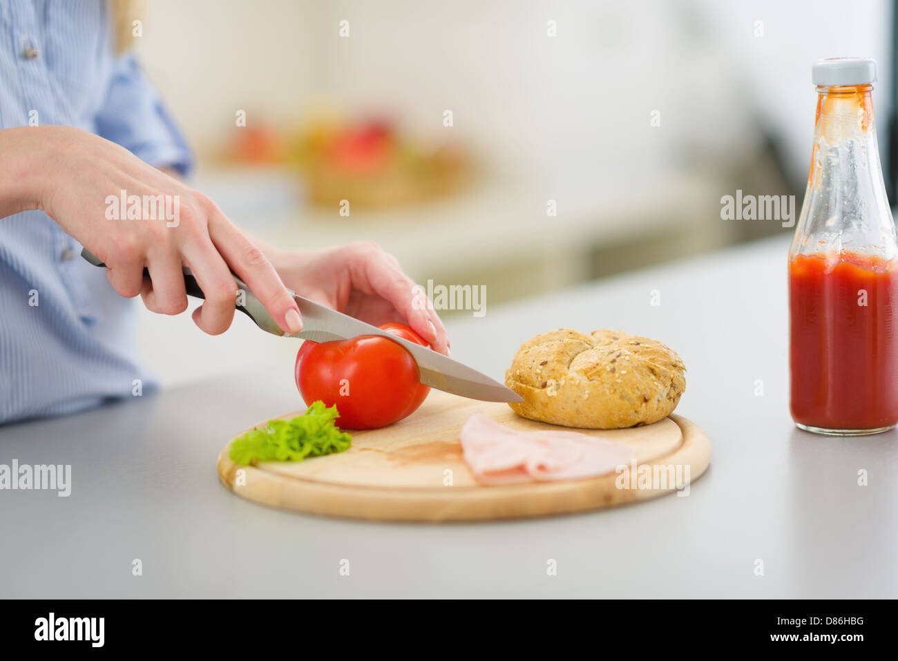 Closeup on young woman making sandwich in kitchen Stock Photo - Alamy