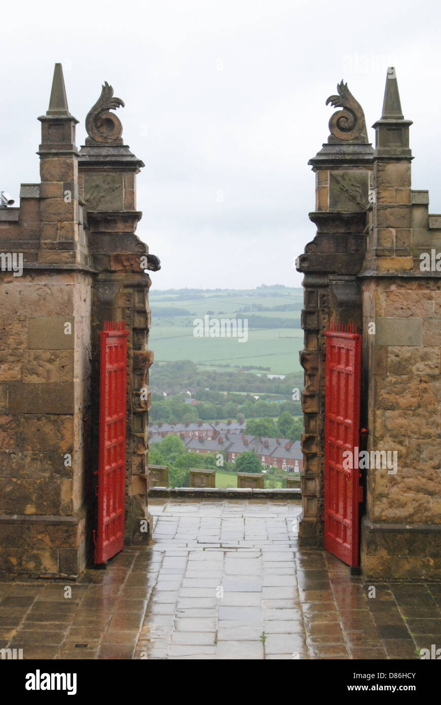 Opened stone gate with iron doors Stock Photo - Alamy