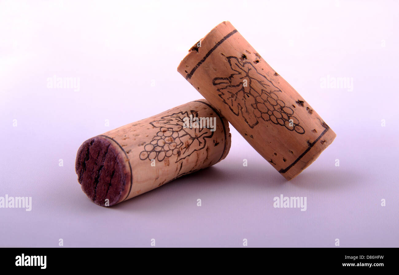 Two corks isolated in a white background Stock Photo - Alamy