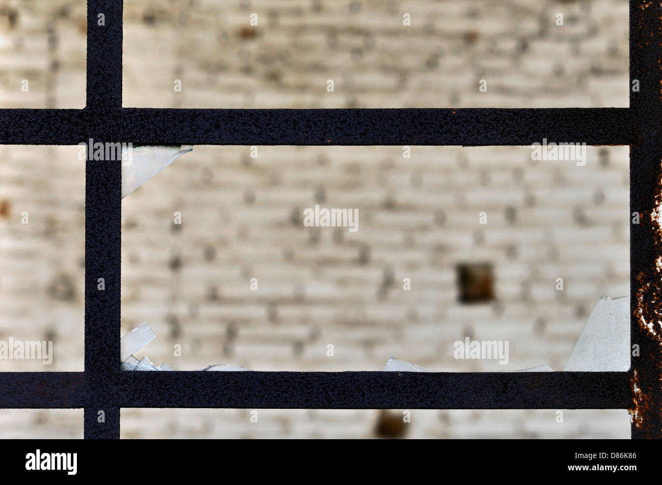 Rusty metal window frame and broken glass in abandoned warehouse Stock ...