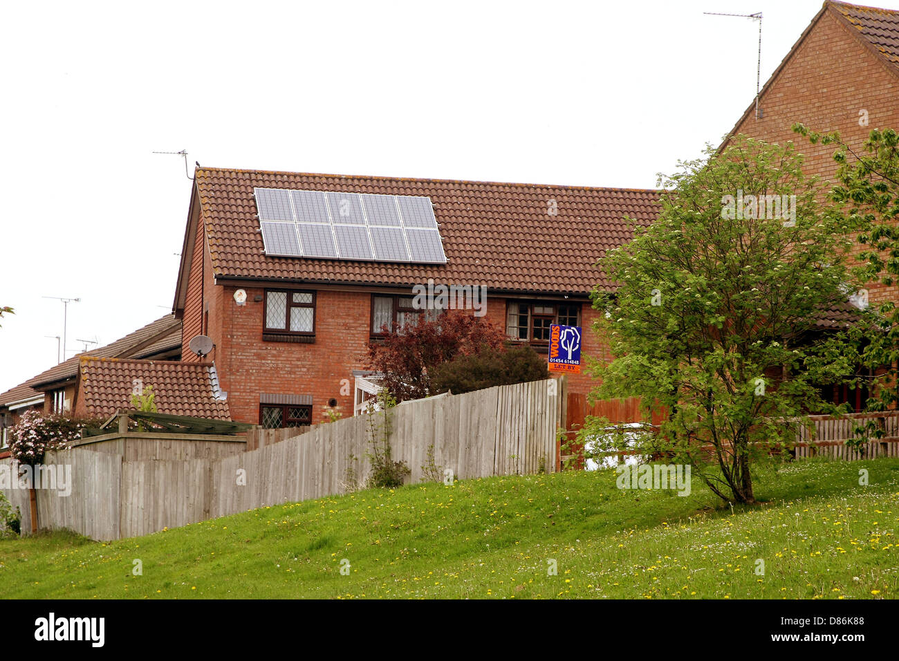 Modern generic English house with a solar panel installation on the ...
