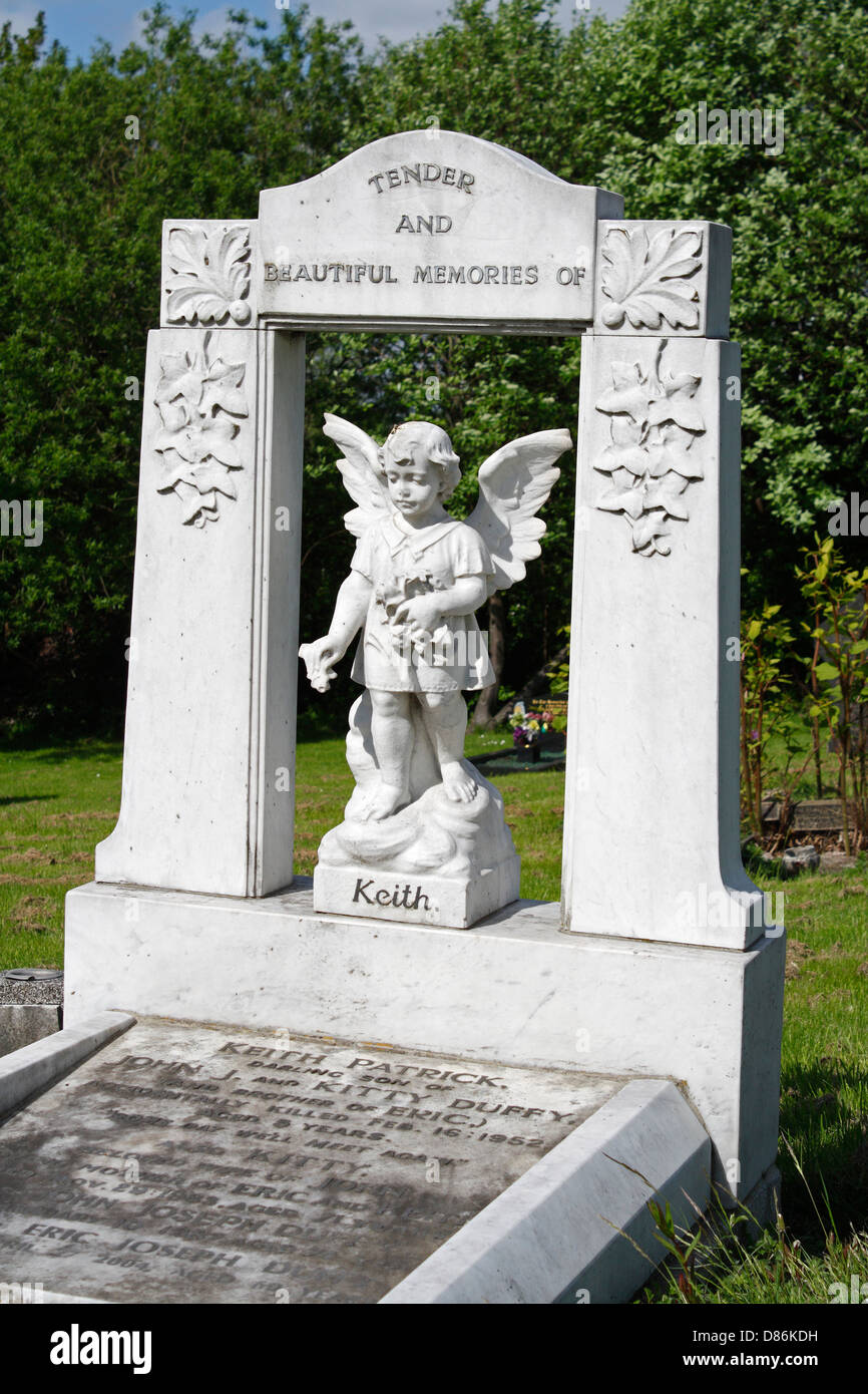 A marble memorial stone showing an angel Stock Photo - Alamy
