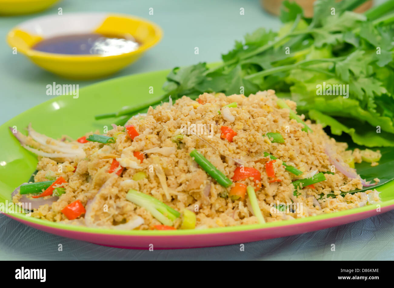 fried fish roe with mix vegetable, served with fresh green vegetable ...
