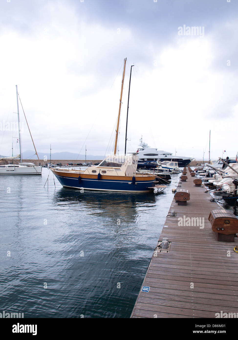 Boat in a harbor Stock Photo - Alamy