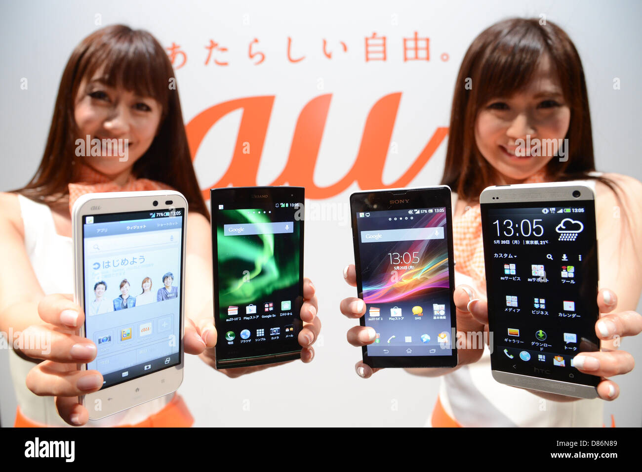May 20, 2013, Tokyo, Japan - Models show a new lineup of KDDI's ...