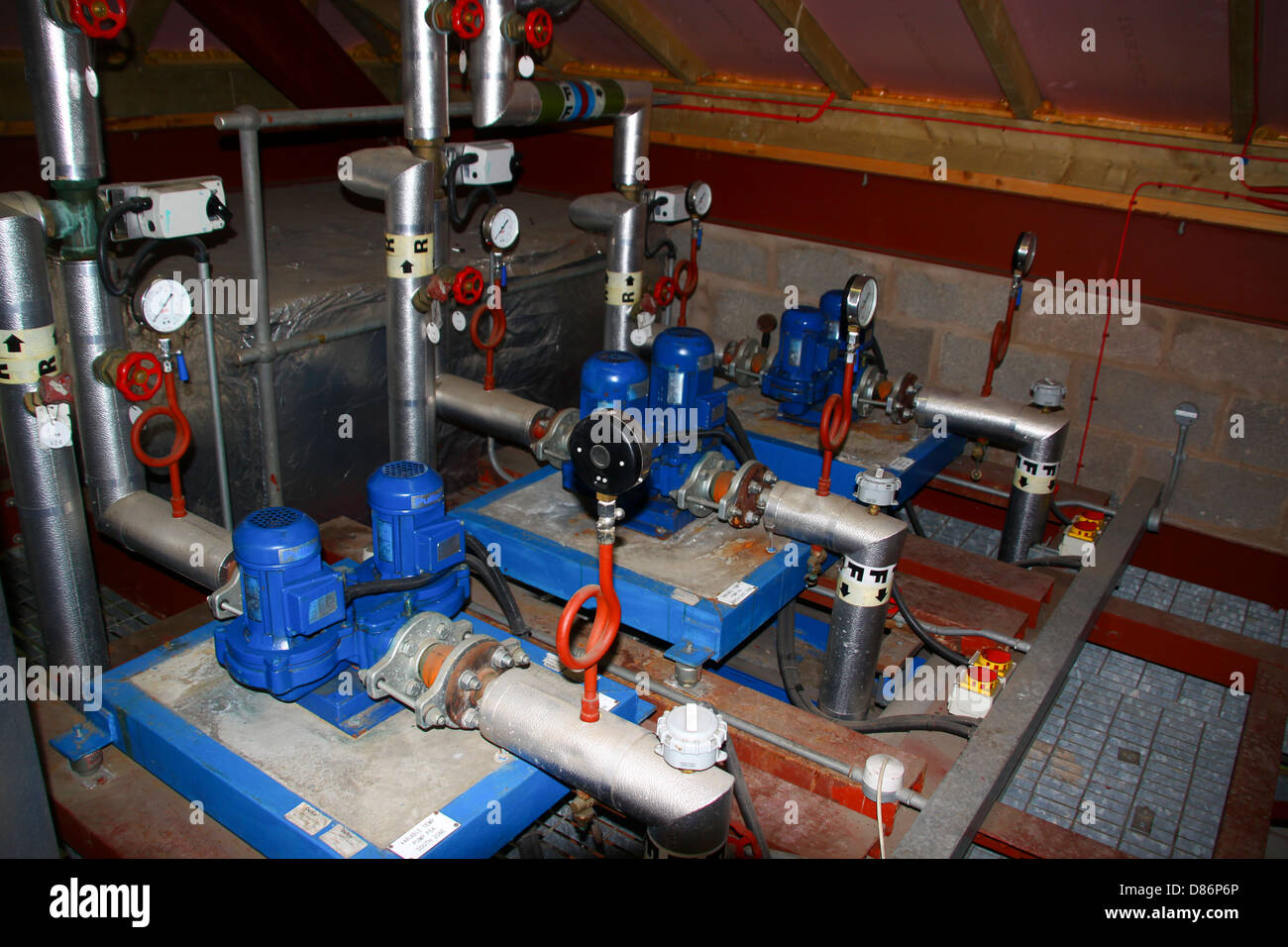 Twin pump sets in commercial heating system plant room Stock Photo - Alamy