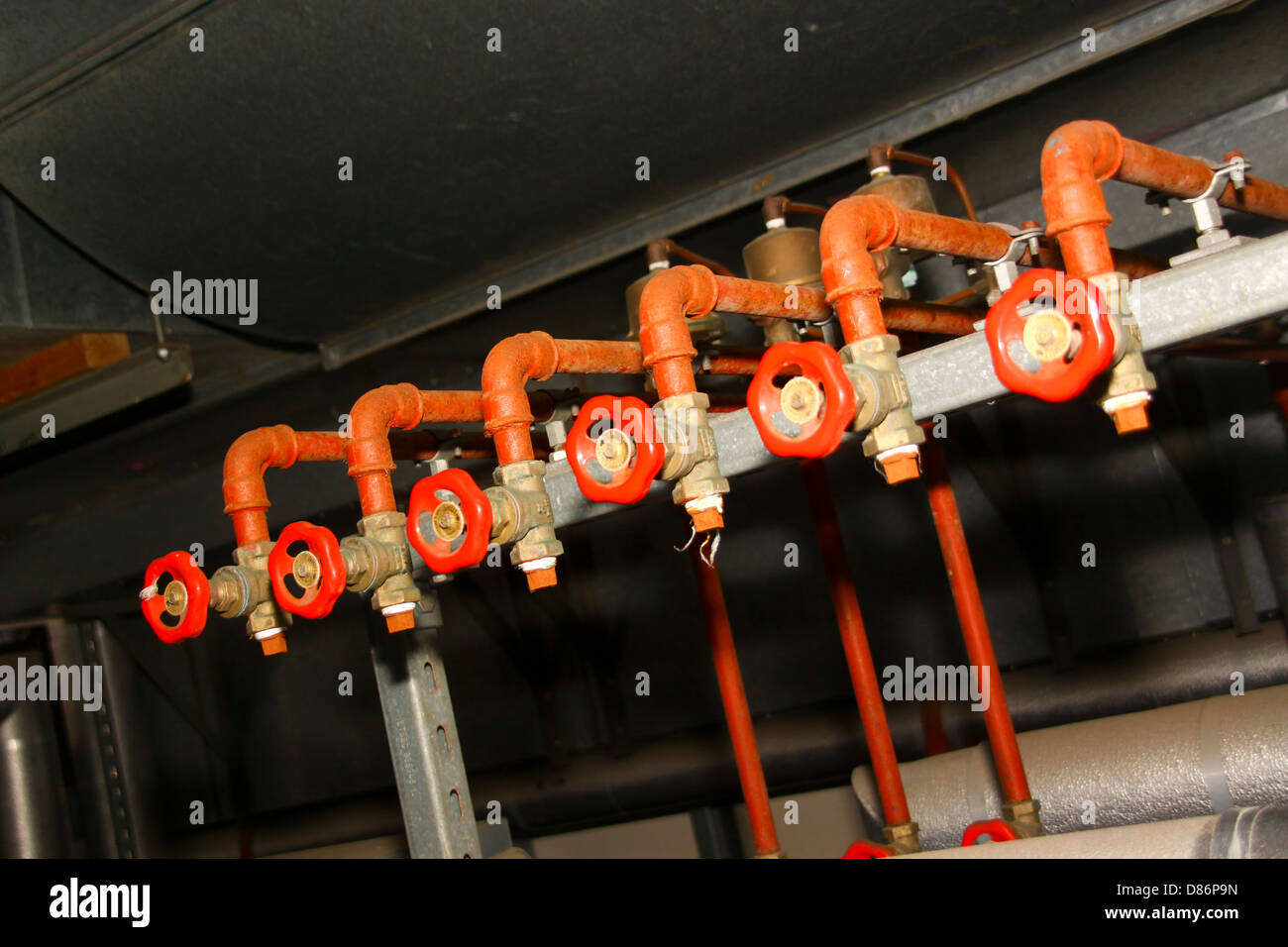 pipe manifold in plant room with stopcocks Stock Photo - Alamy