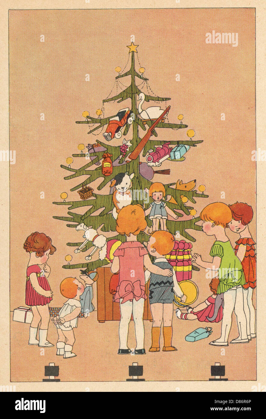 Children round Christmas tree, 1927 Stock Photo - Alamy