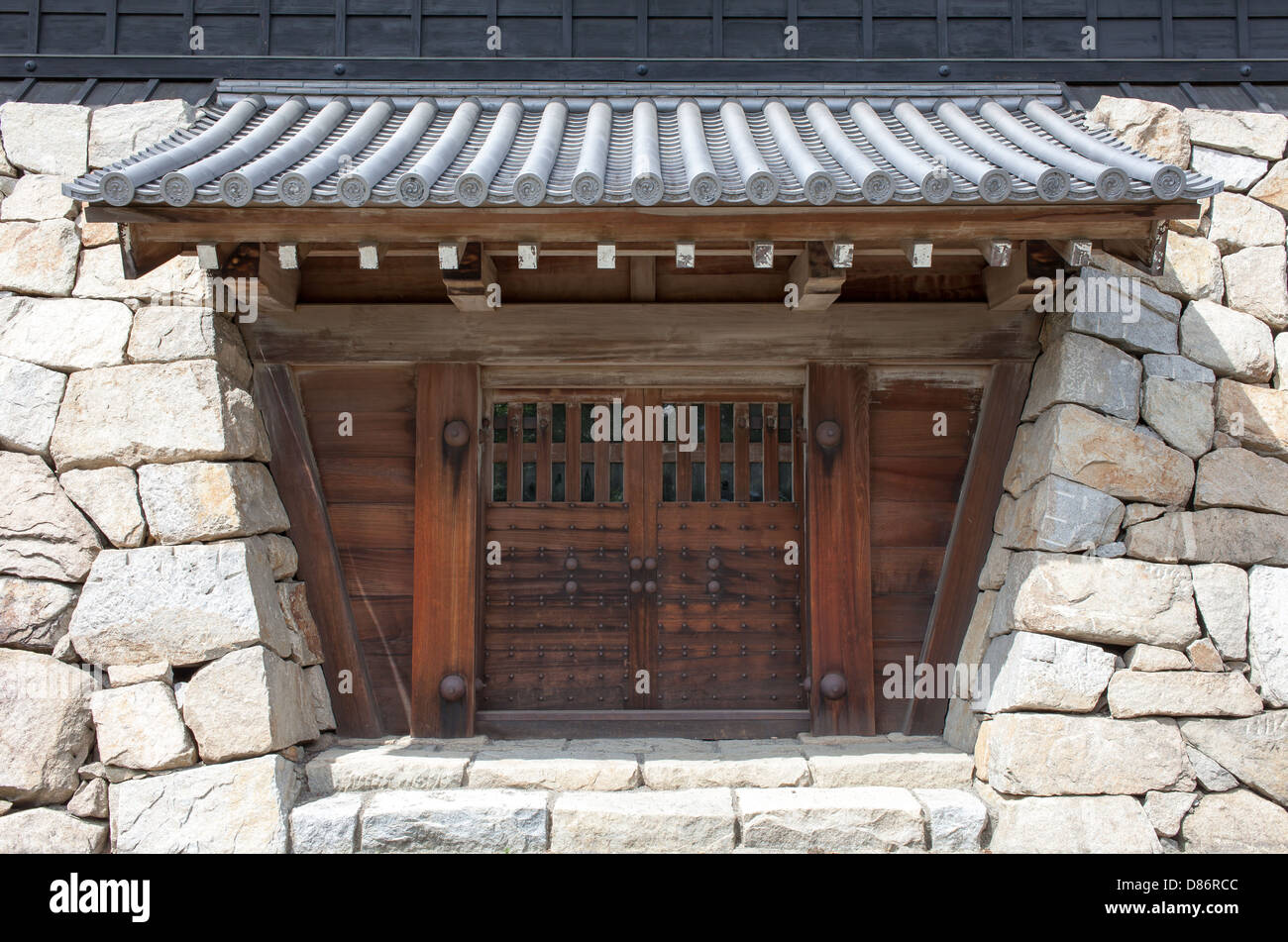 closed japanese castle gate and rock wall Stock Photo - Alamy