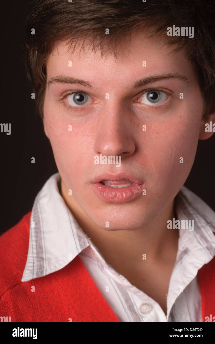Young man posing and cutting up in studio environment Stock Photo - Alamy