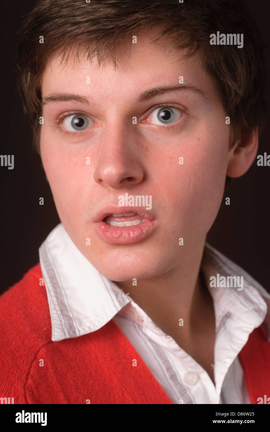 Young man posing and cutting up in studio environment Stock Photo - Alamy