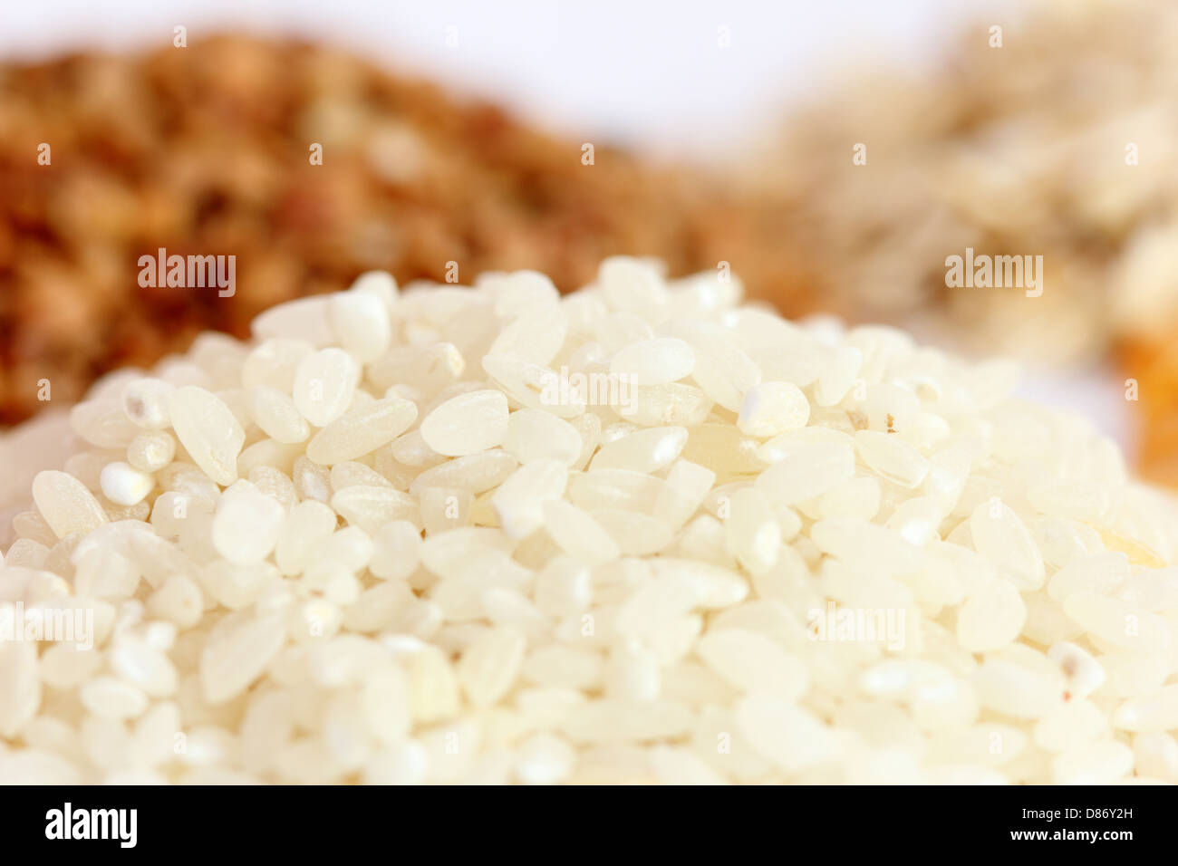 sprinkle rice grains on a white background Stock Photo - Alamy