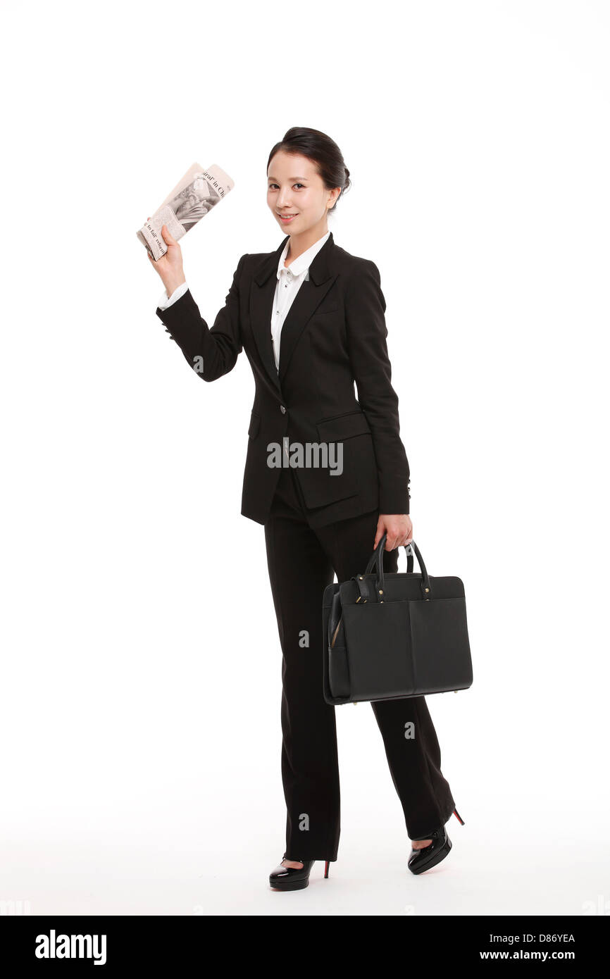 young businesswoman posing in studio newspaper briefcase Stock Photo ...