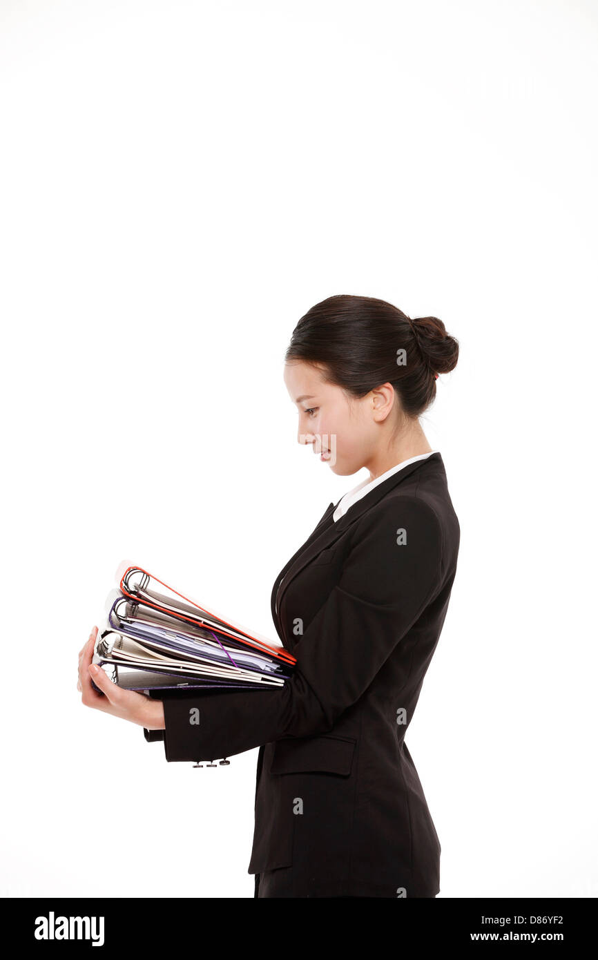 young businesswoman posing in studio several binders Stock Photo - Alamy