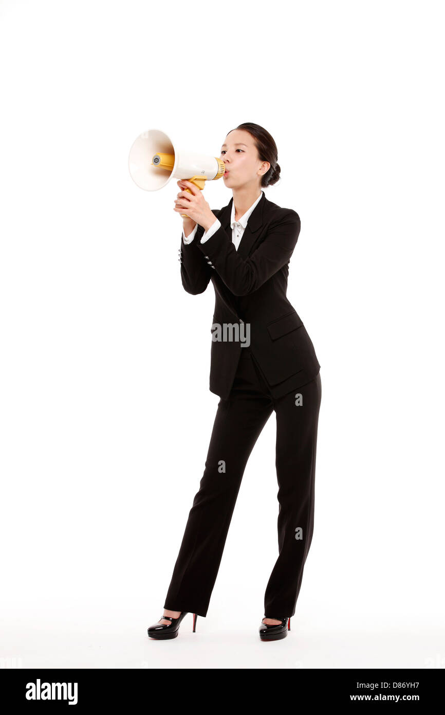 young businesswoman posing in studio megaphone Stock Photo - Alamy
