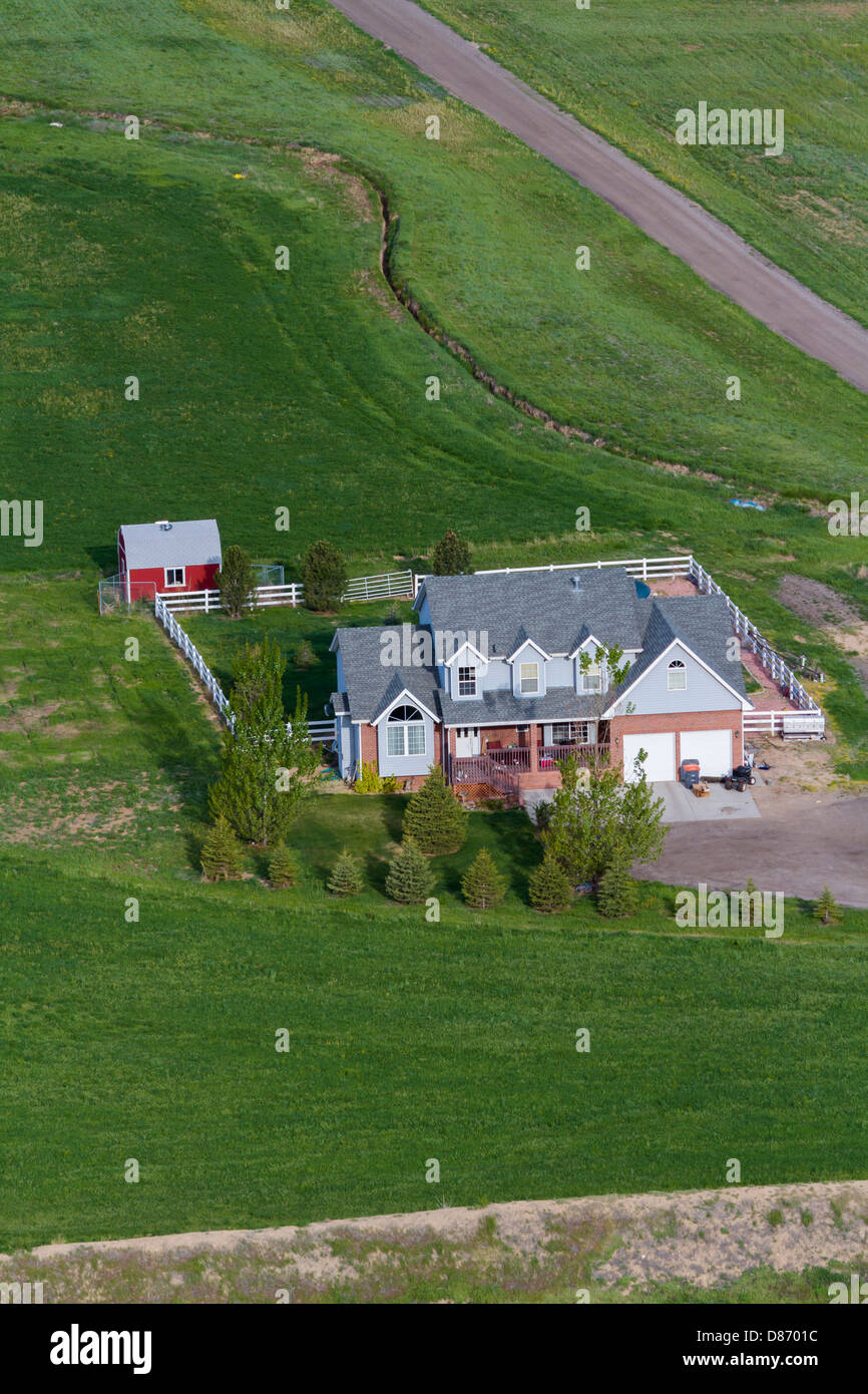 Large farm house on green field Stock Photo - Alamy