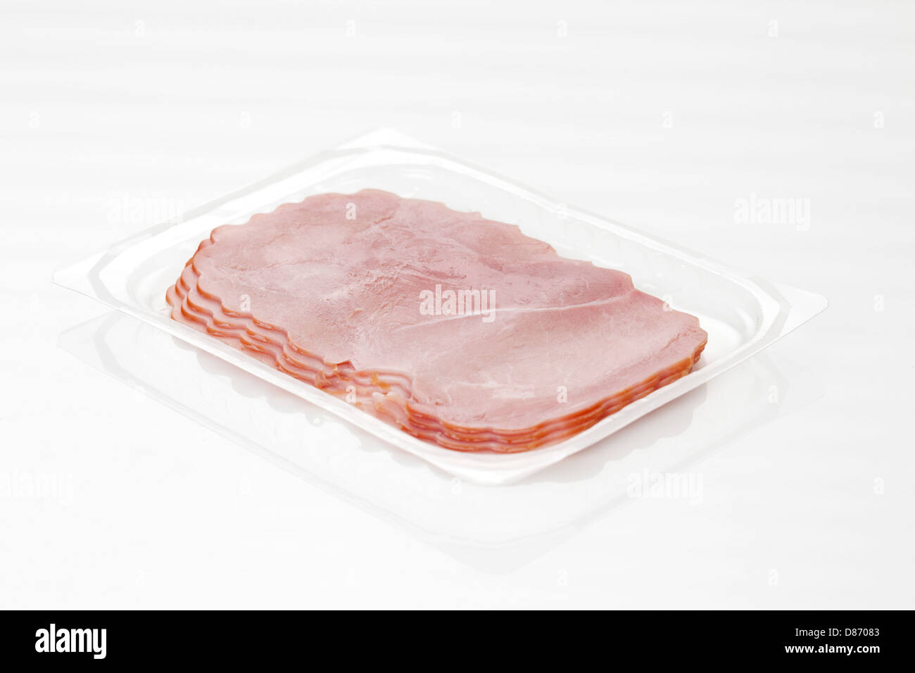 Boiled ham in plastic tray, close up Stock Photo - Alamy