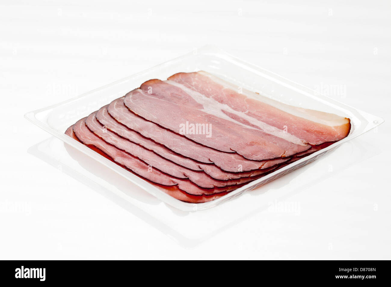 Black forest ham in plastic tray, close up Stock Photo - Alamy
