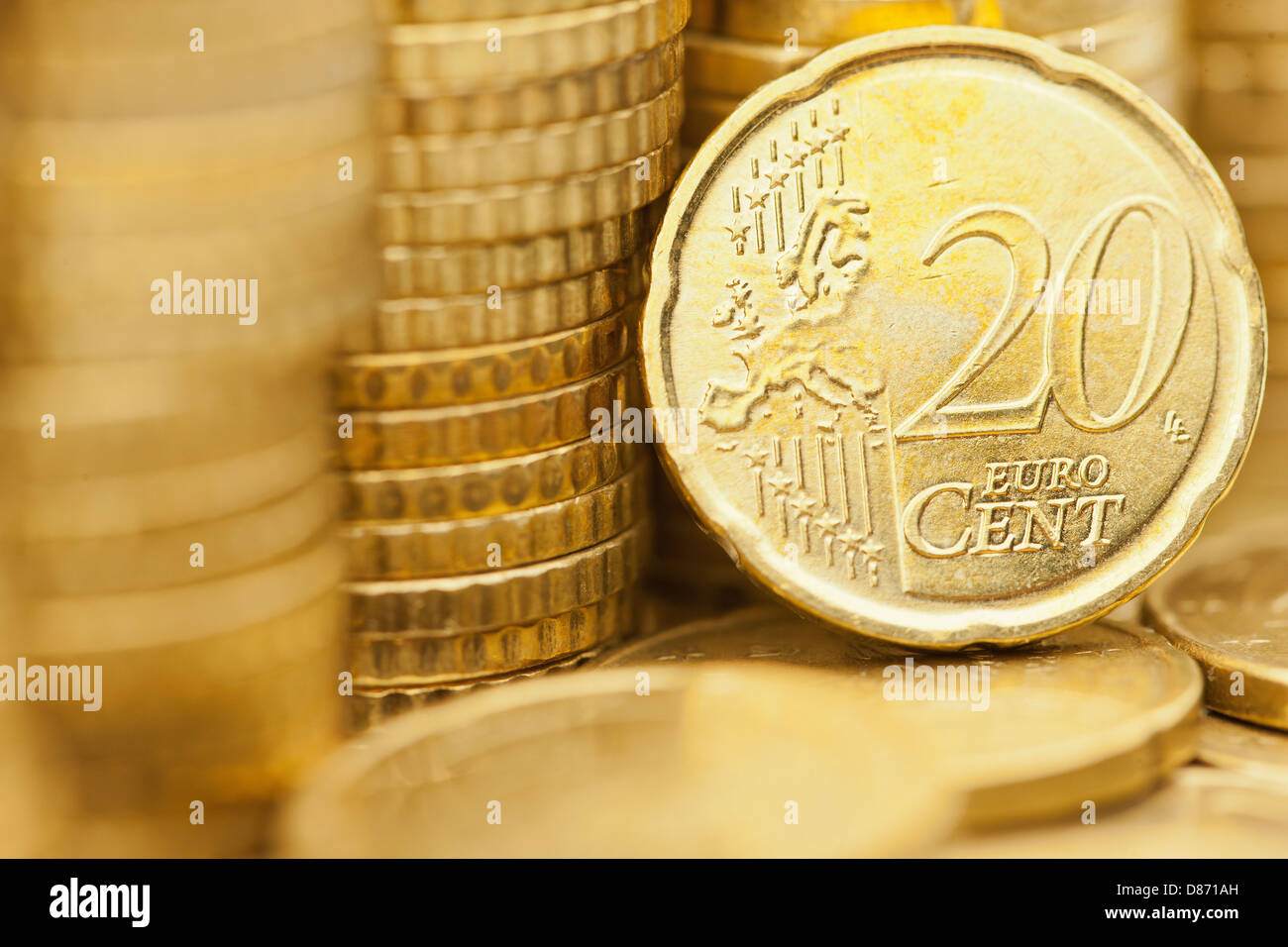 Stack of Euro coins with twenty euro cent coin, close up Stock Photo ...