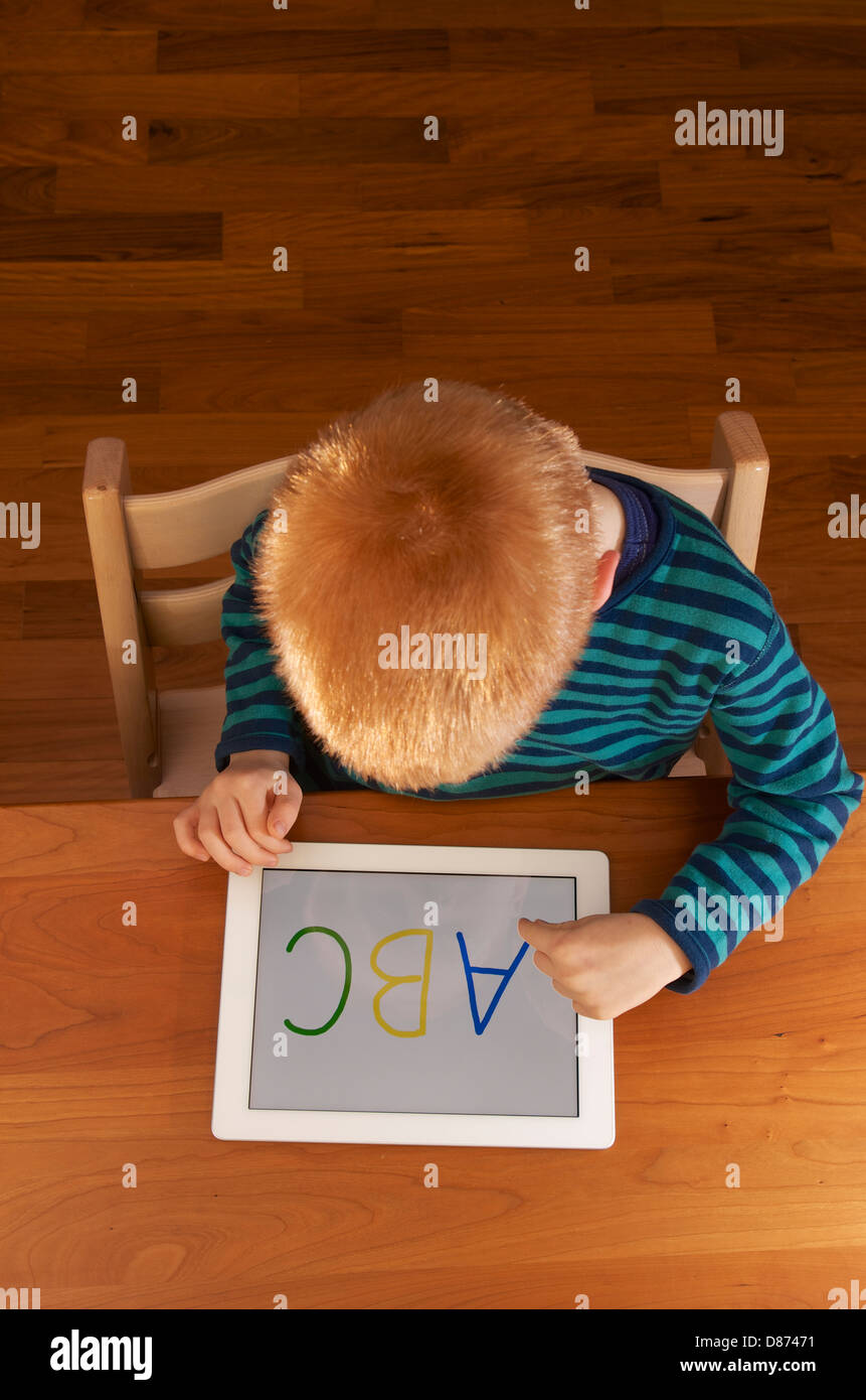 Germany, Baden Wuerttemberg, Constance, Boy using digital tablet Stock ...