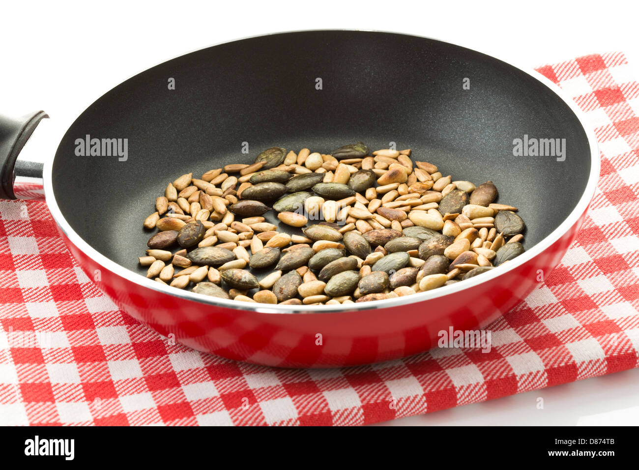 Variety of eatable seeds in frying pan, close up Stock Photo - Alamy