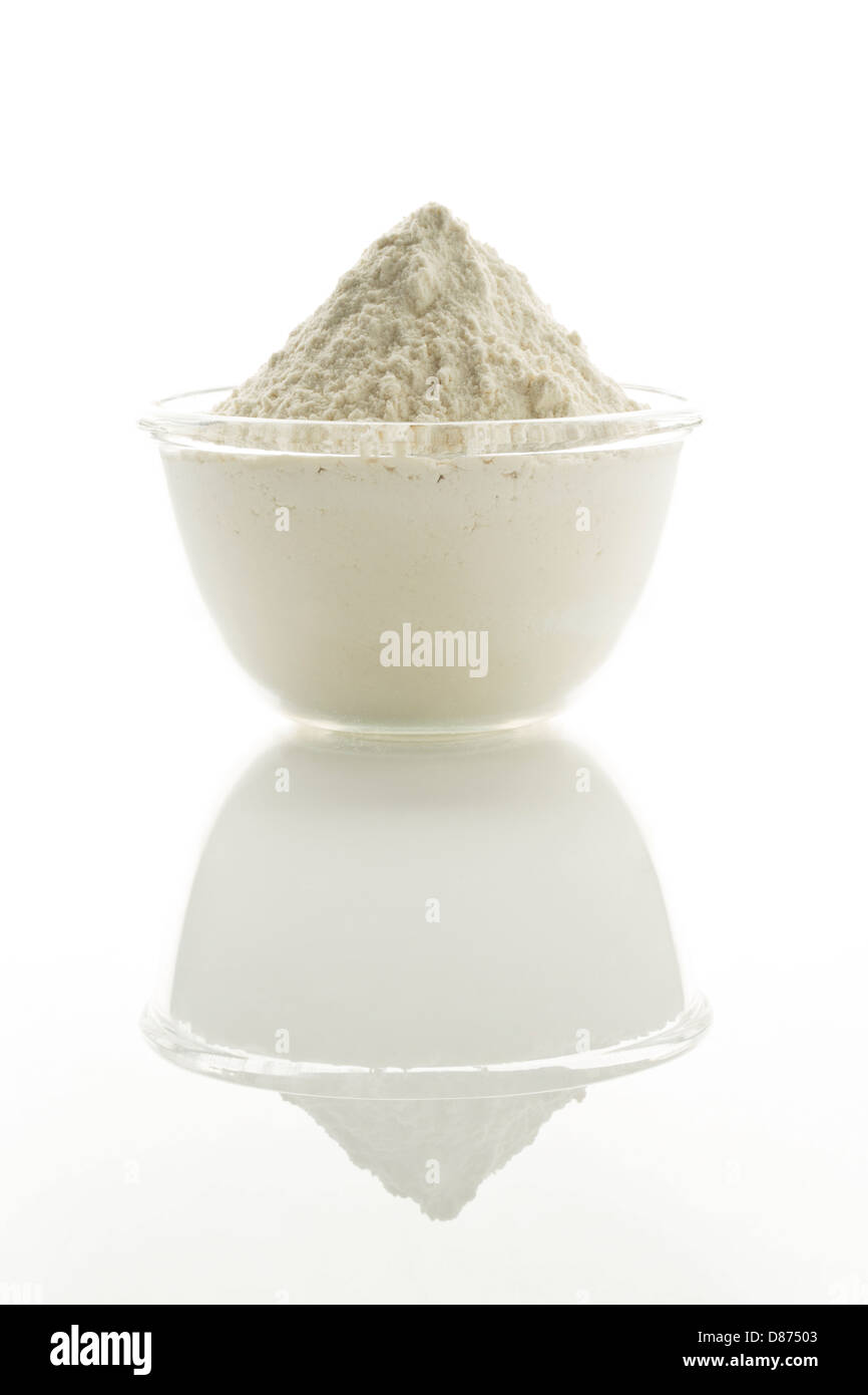 Bowl of flour on white background, close up Stock Photo - Alamy