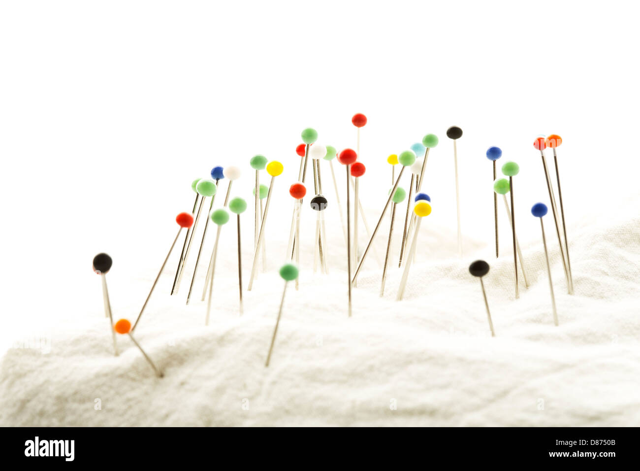 Pin cushion against white background, close up Stock Photo - Alamy