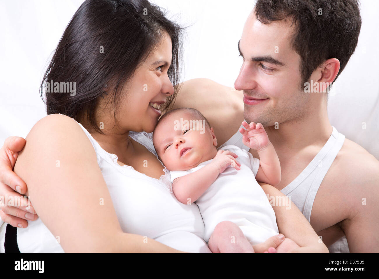 Parents with baby boy, smiling Stock Photo - Alamy